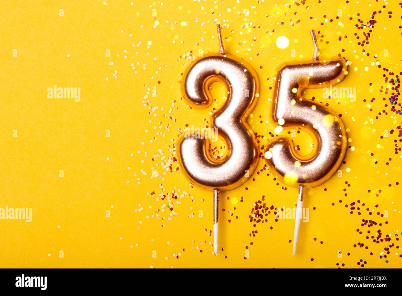 35 years celebration. Greeting banner. Gold candles in the form of ...