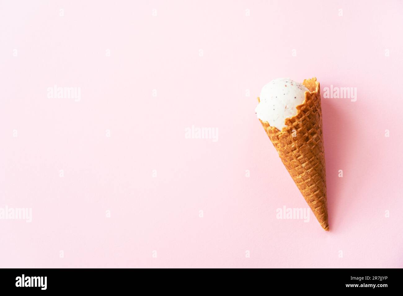 Strawberry ice cream cone top view on pink Stock Photo - Alamy