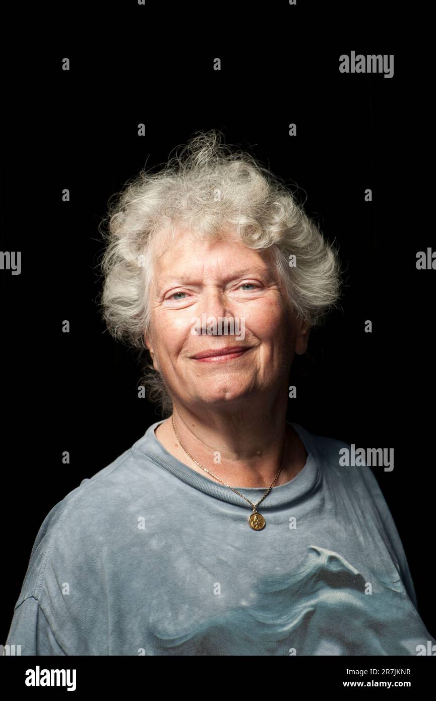 An older Canadian women with white hair stands for a close cropped ...