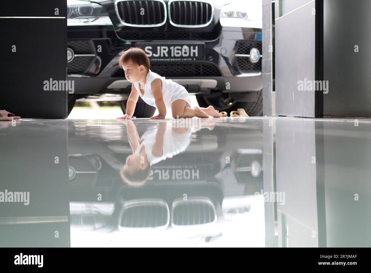 A baby crawls across squeaky clean floors in a multi million dollar ...