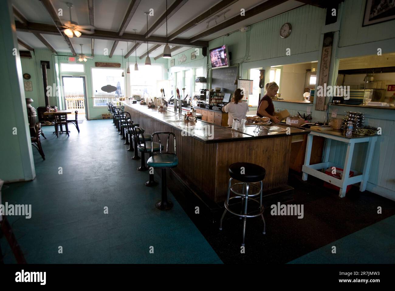 Waitstaff prepare the empty bar for the evening crowd at a local ...