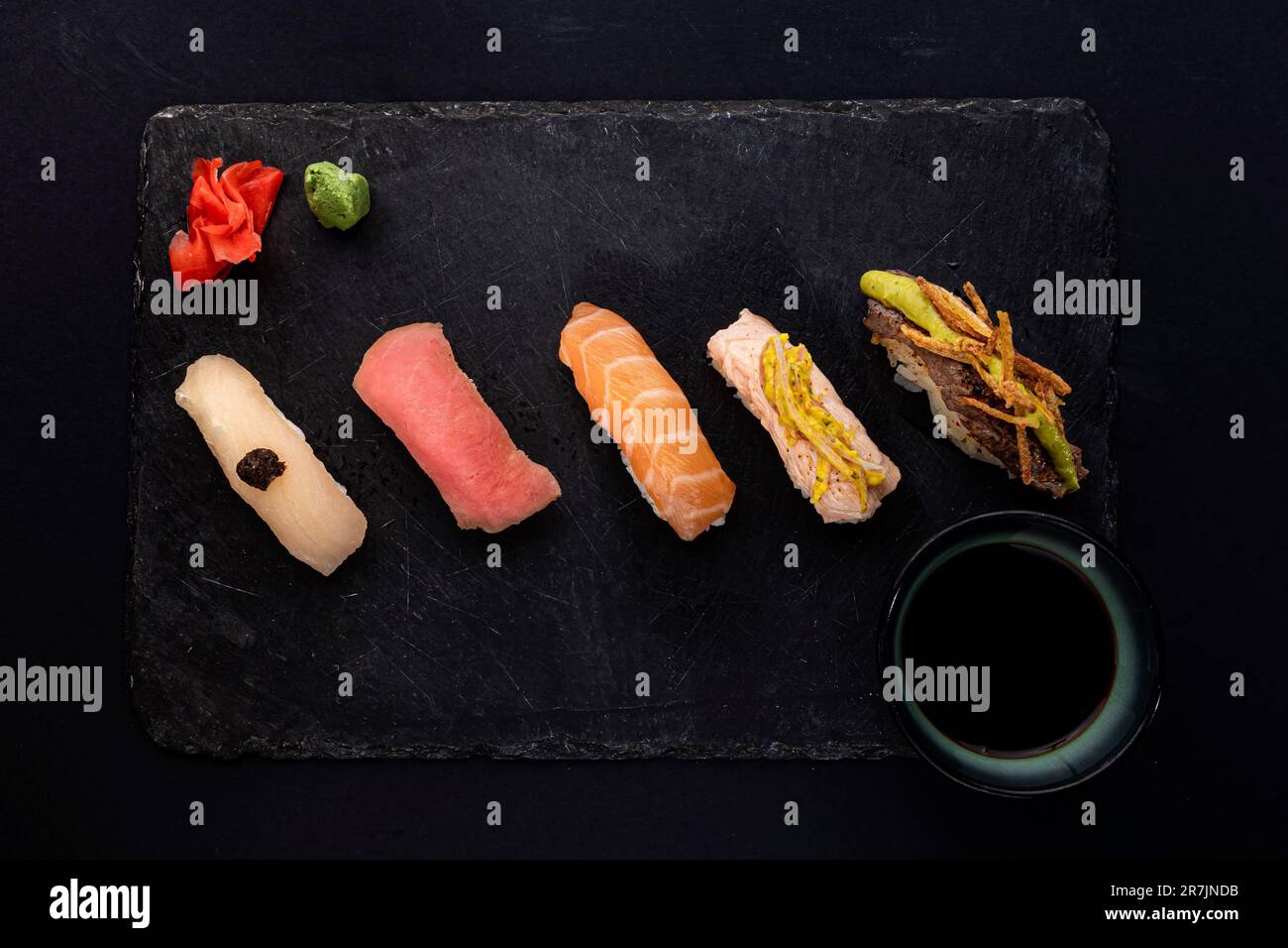 A close-up shot of a platter of traditional Japanese sushi nigiri ...