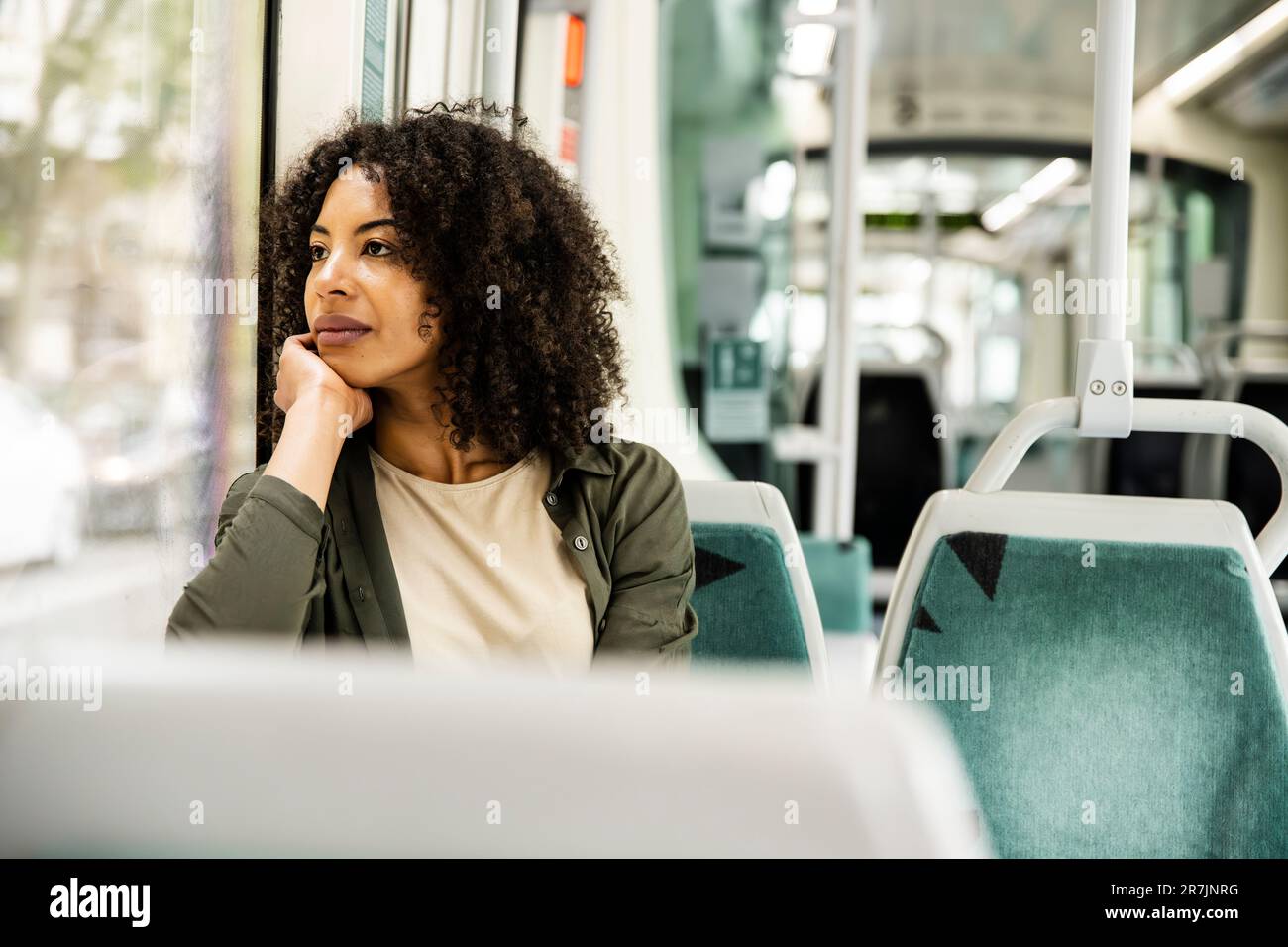 Woman looking out bus window hi-res stock photography and images - Alamy