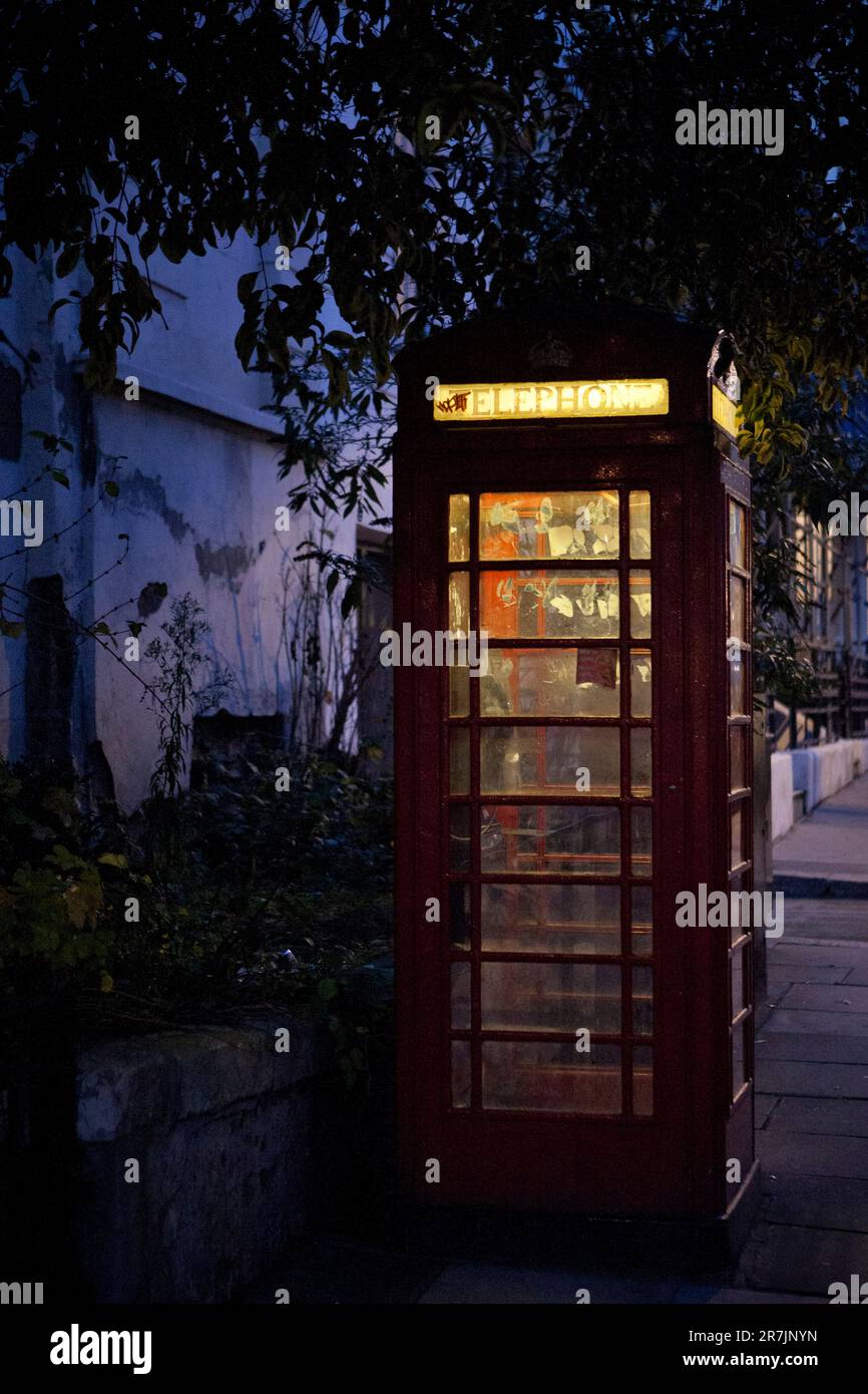 A traditional phone booth at dusk in London, UK Stock Photo - Alamy