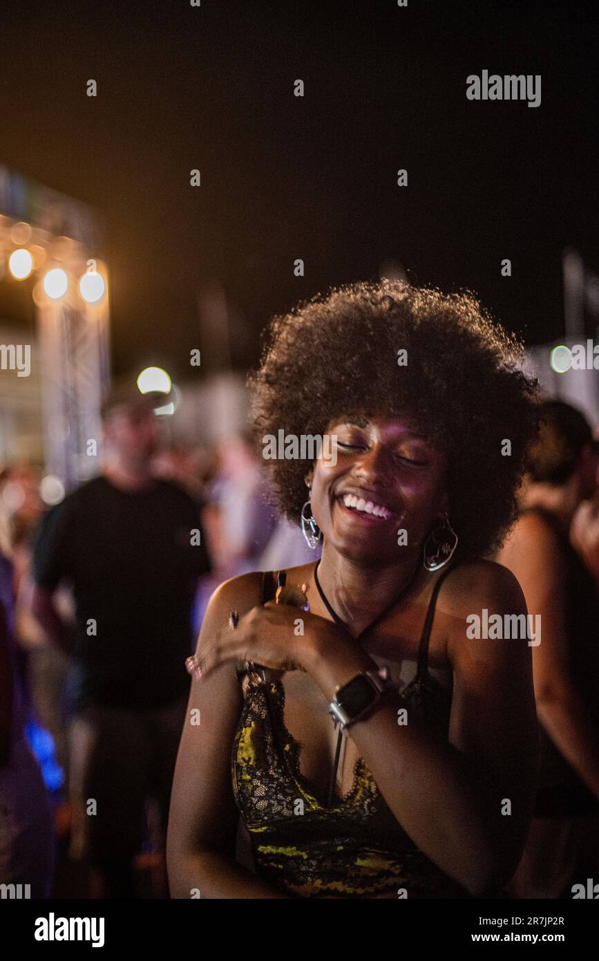 Black Gen Z female Enjoying the Music at the beach Stock Photo - Alamy