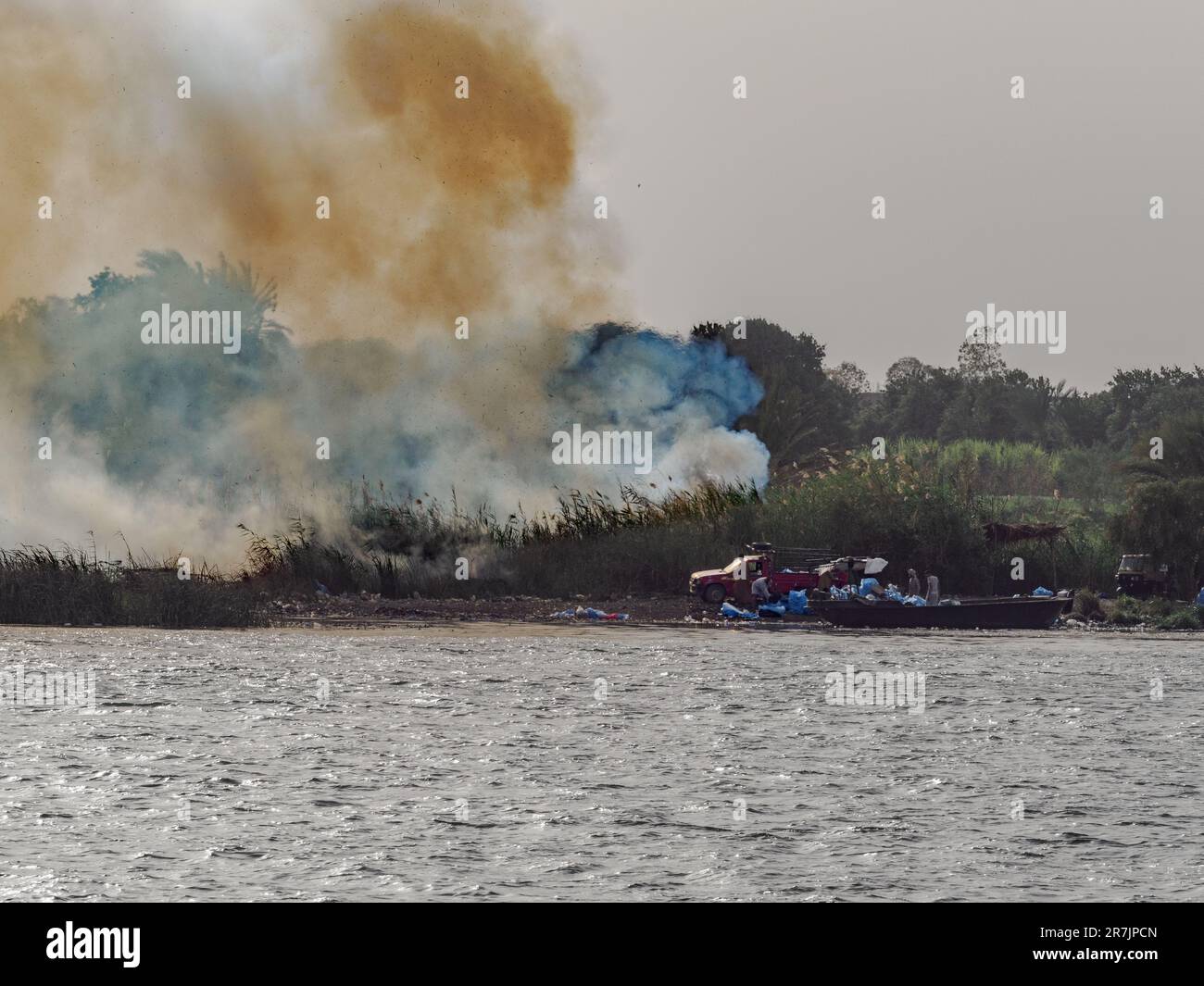 Poisonous Fire on Nile River Bank Reveals Illegal Garbage Dumpin Stock ...