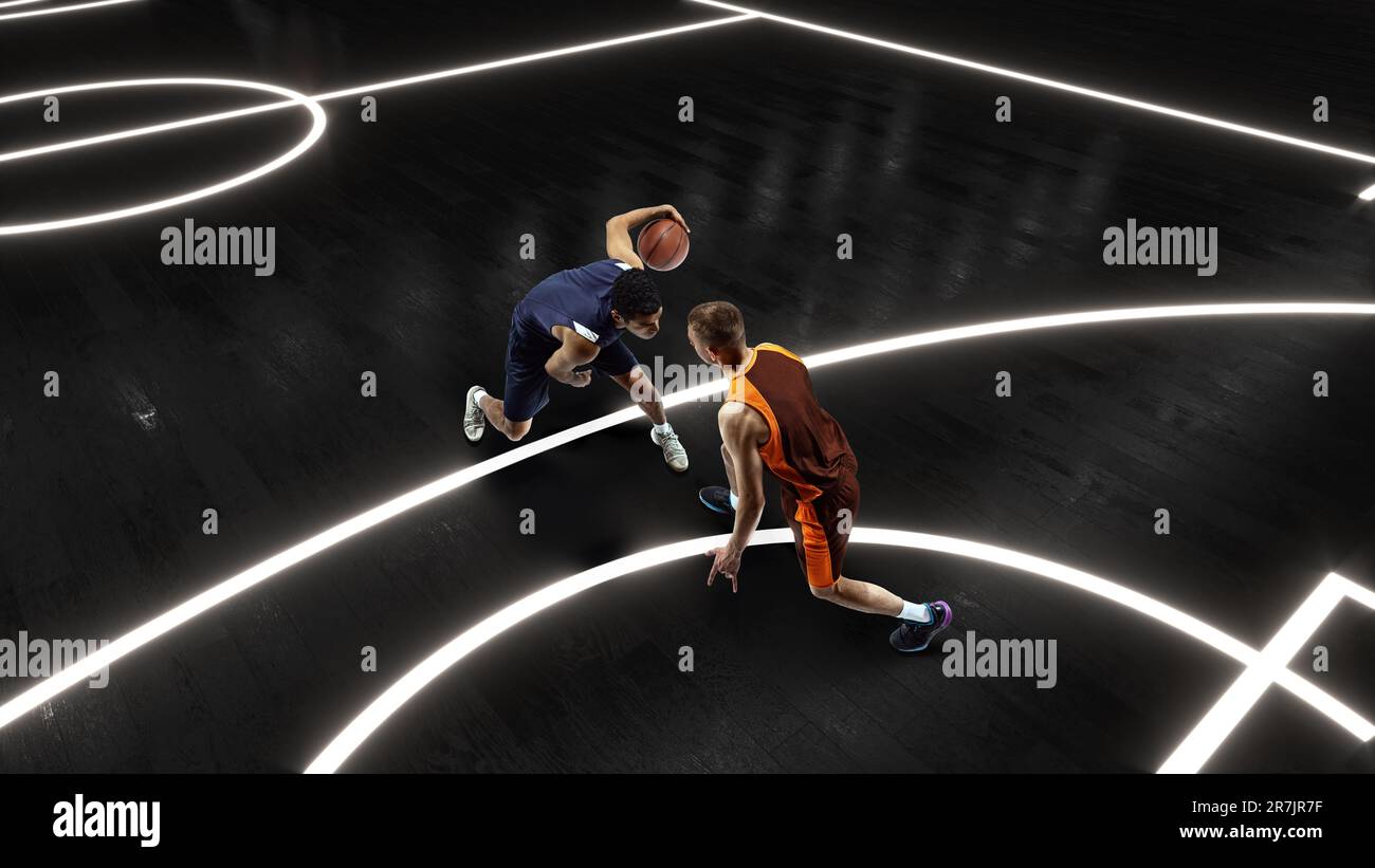 Aerial view of professional two basketball players in action with ...