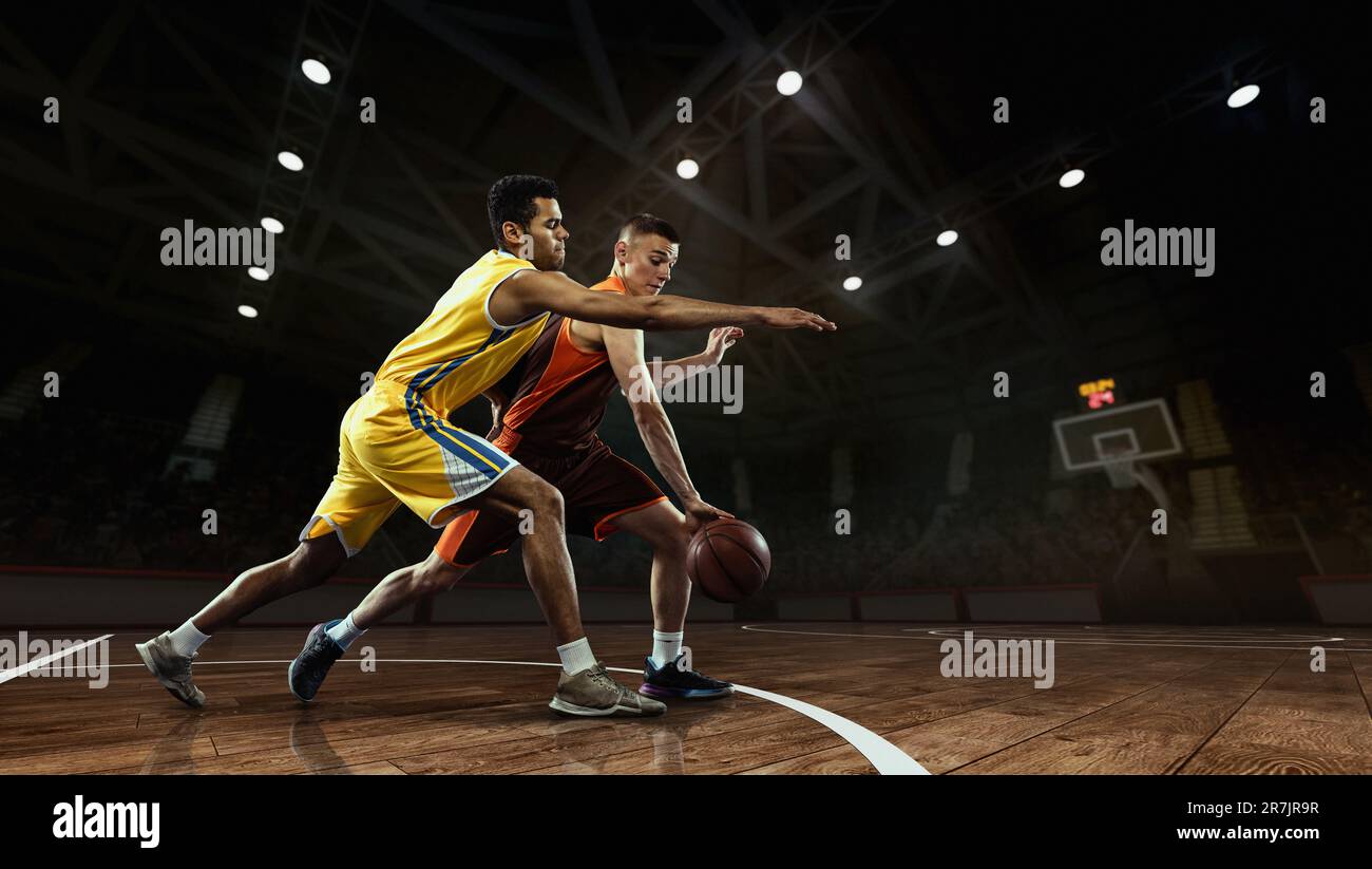 Basketball match. Professional two basketball players in action with ...