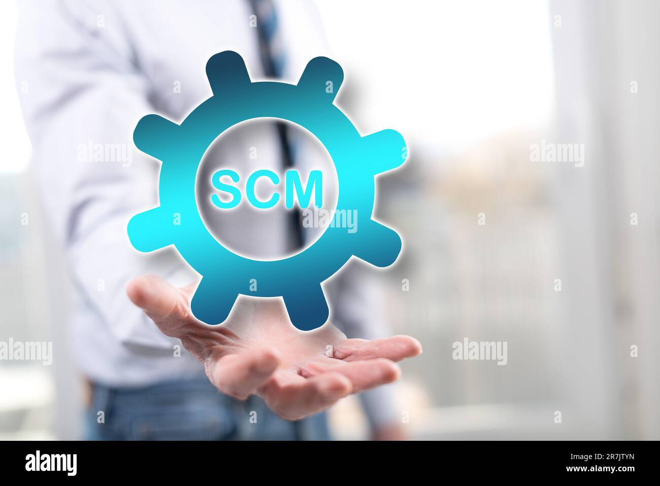 Scm concept above the hand of a man in background Stock Photo - Alamy
