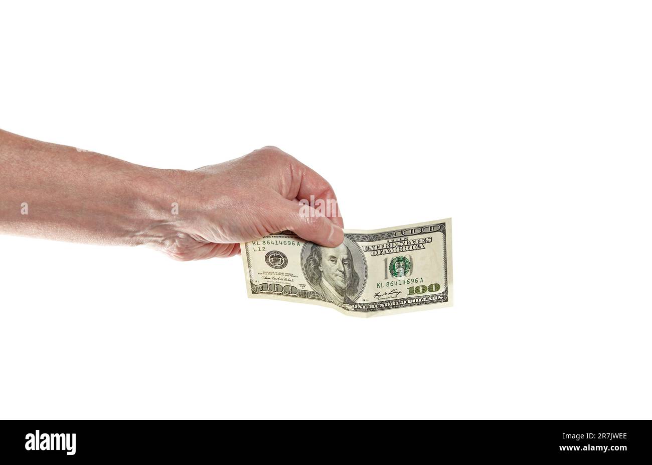 Men's hand holding 100 dollar bill isolated on white background. One ...