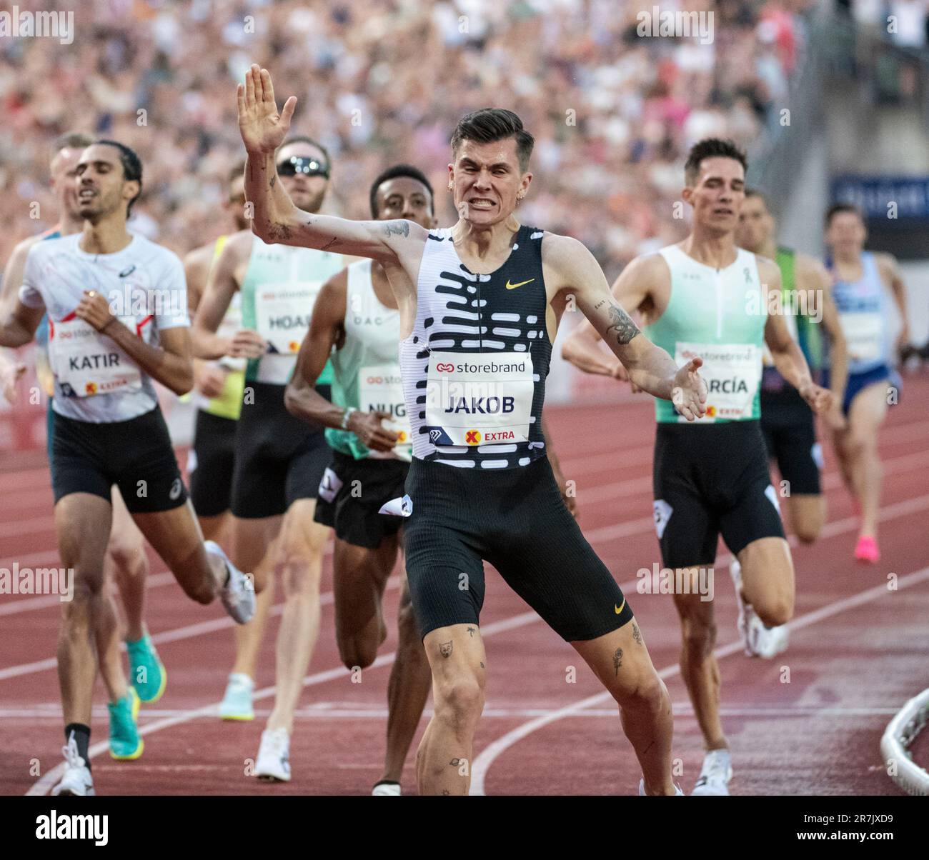 Jakob Ingebrigtsen of Norway crosses the finishing line to win the men ...