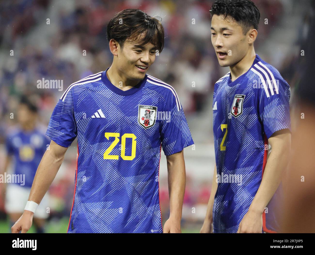 Toyota, Japan. 15th June, 2023. Japan's Takefusa Kubo (L) smiles with ...