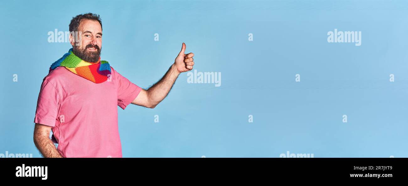 banner lgtb man wearing a scarf with lgtb pride colors. thumbs up and ...