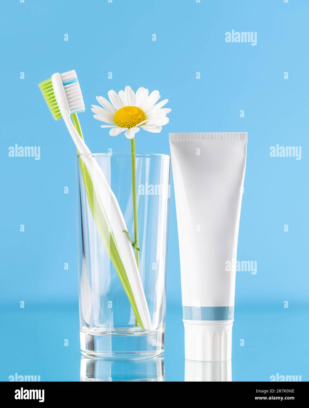 A clean and refreshing image featuring toothpaste and toothbrushes ...