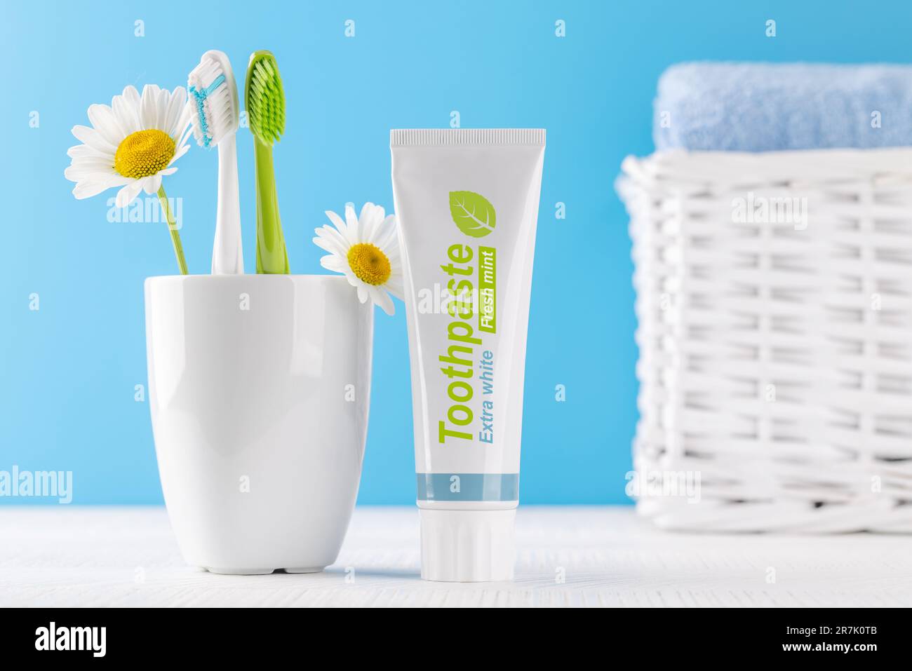 A clean and refreshing image featuring toothpaste and toothbrushes ...