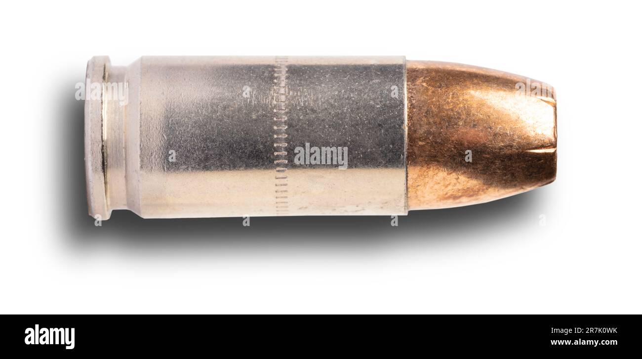 Shadow below a silver looking cartridge for a 8 mm with hollow point ...