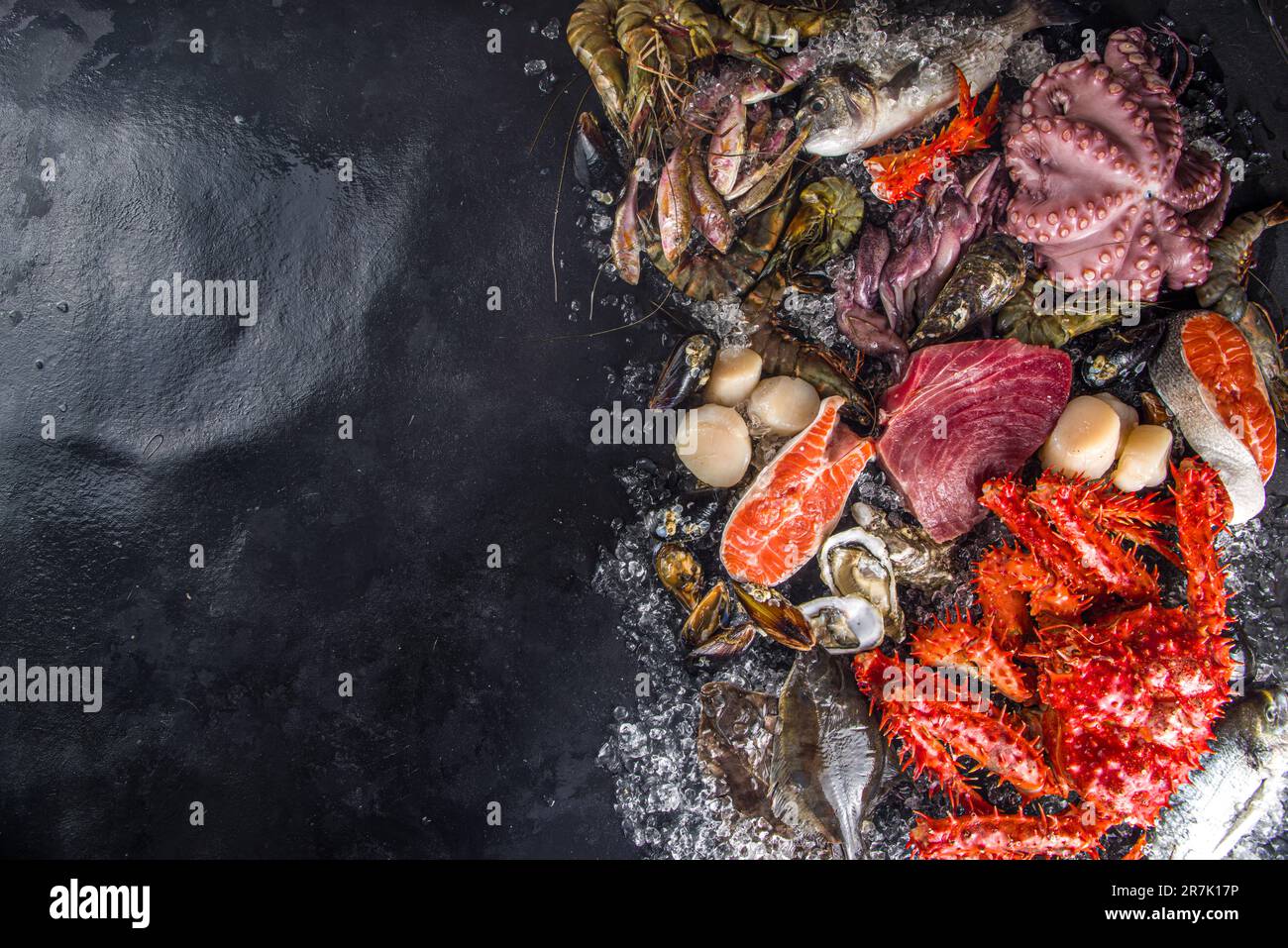 Set of various fresh raw seafood - octopus, crab, squid, shrimp prawn ...