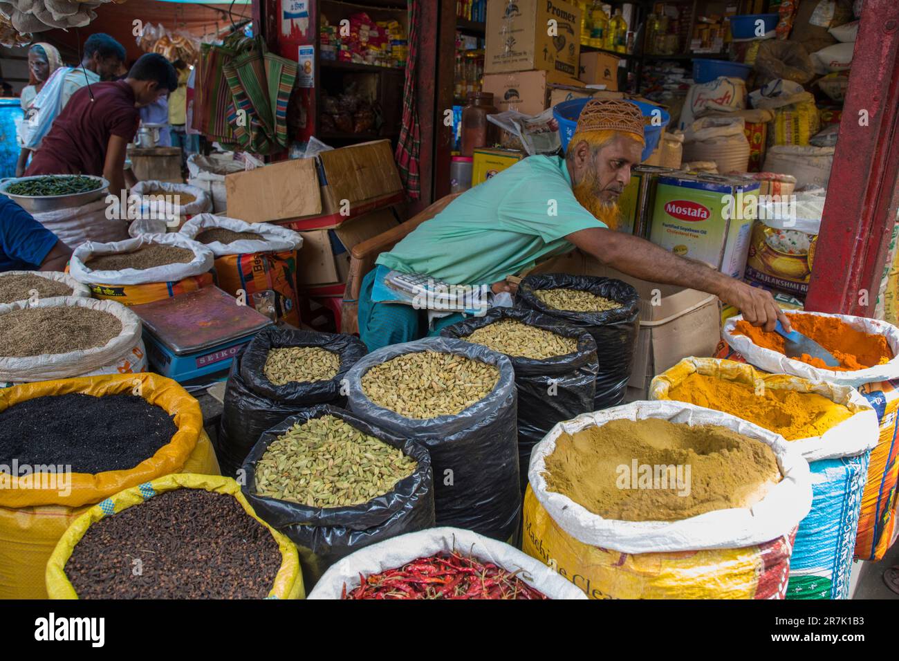 Spice seller at a village market at Ghior in Manikganj, Bangladesh ...