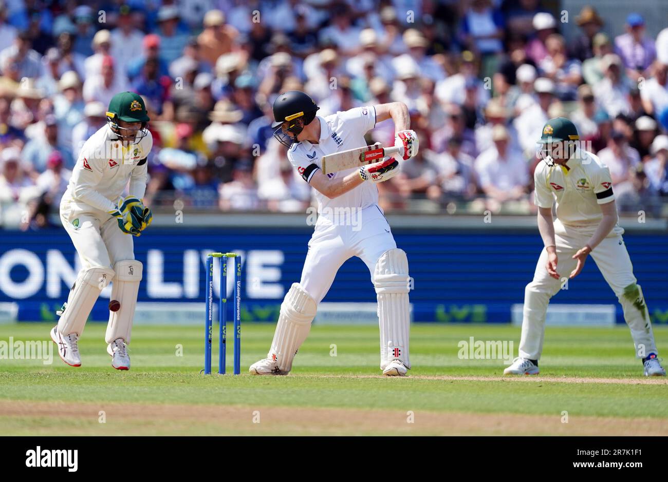 England's Zak Crawley is almost caught by Australia's Alex Carey on day ...