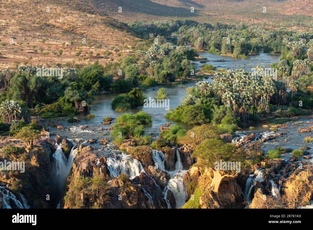 River rushing over jagged cliffs, Epupa falls Cunene River in Namibia ...