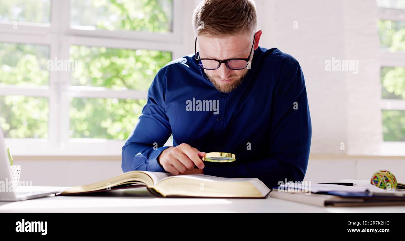 Lawyer Law Book With Magnifying Glass In Courtroom Stock Photo - Alamy