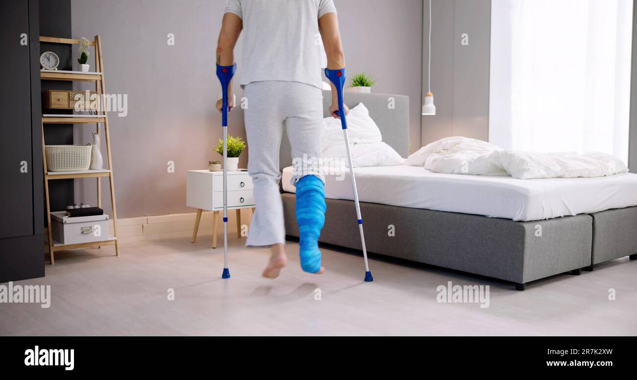 Man With Broken Leg After Accident Using Crutches Stock Photo - Alamy