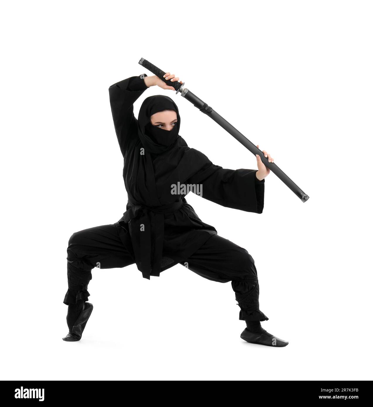 Female ninja with sword on white background Stock Photo - Alamy