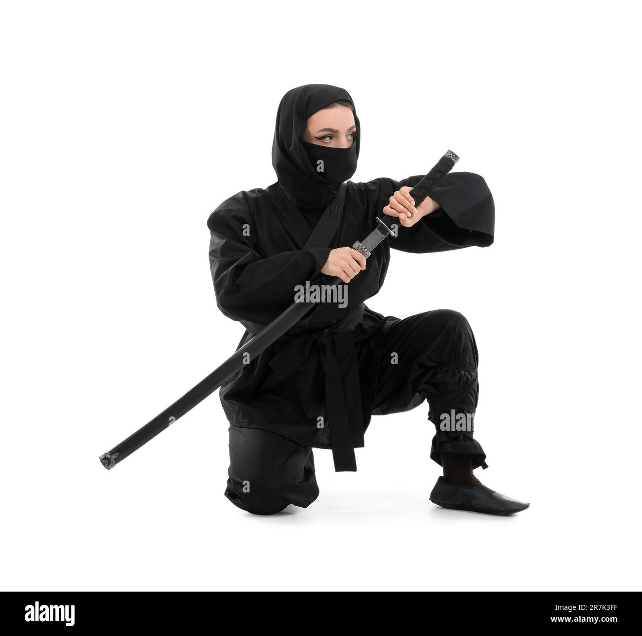 Female ninja with sword on white background Stock Photo - Alamy