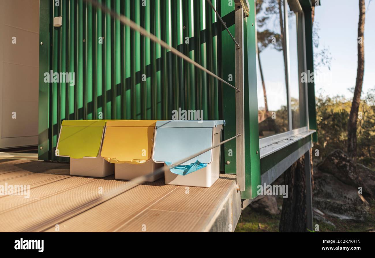 Three waste bins for waste separation Stock Photo - Alamy