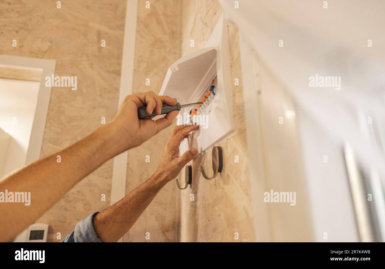 Technician installing fuse box at sustainble home Stock Photo - Alamy Technician installing fuse box at sustainble home Stock Photo - Alamy