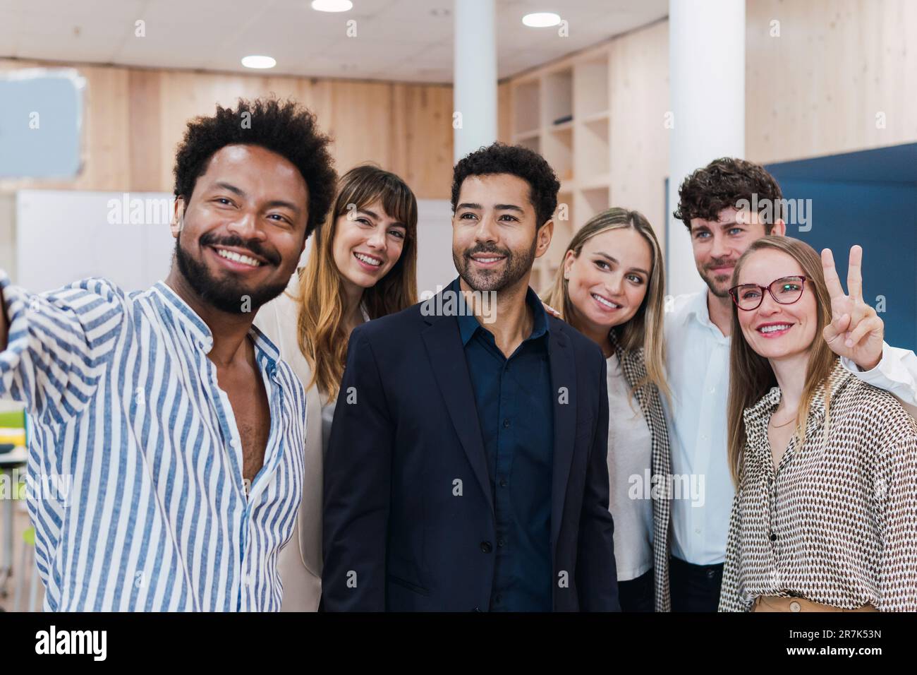 Happy business team posing for a selfie in office Stock Photo - Alamy
