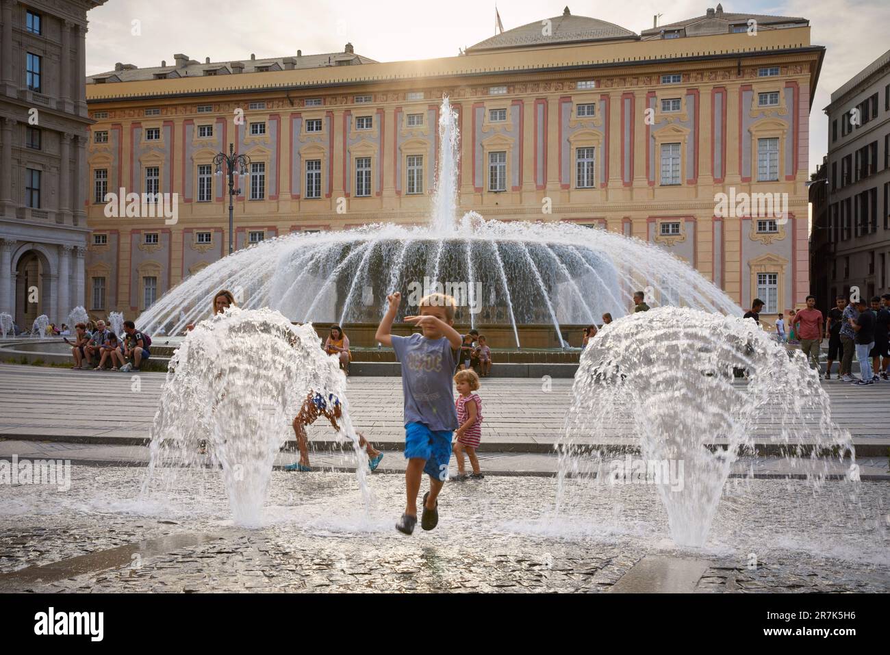 Children playing in fountains, Piazza De Ferrari, Genoa, Liguria, Italy ...