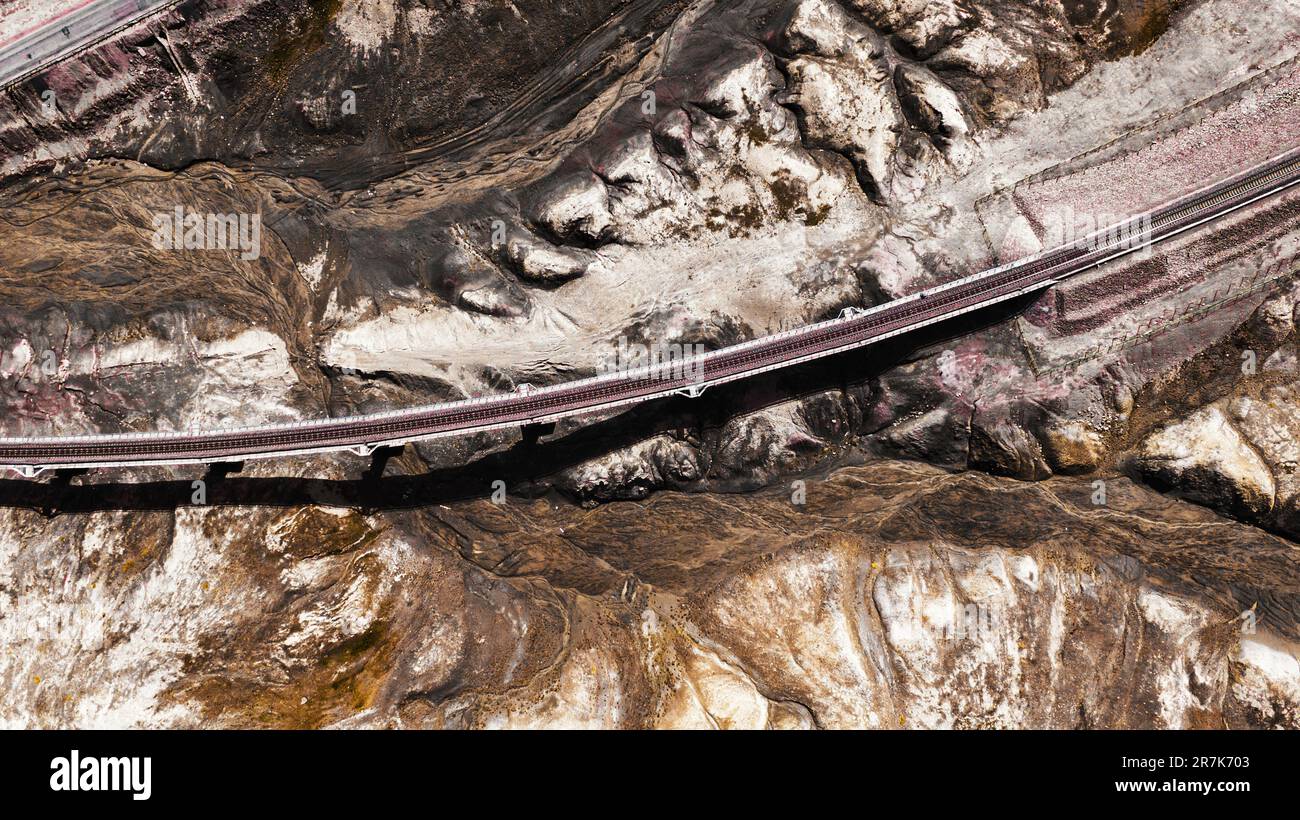 An aerial view of two railway tracks running parallel to each other, with the top and bottom ...