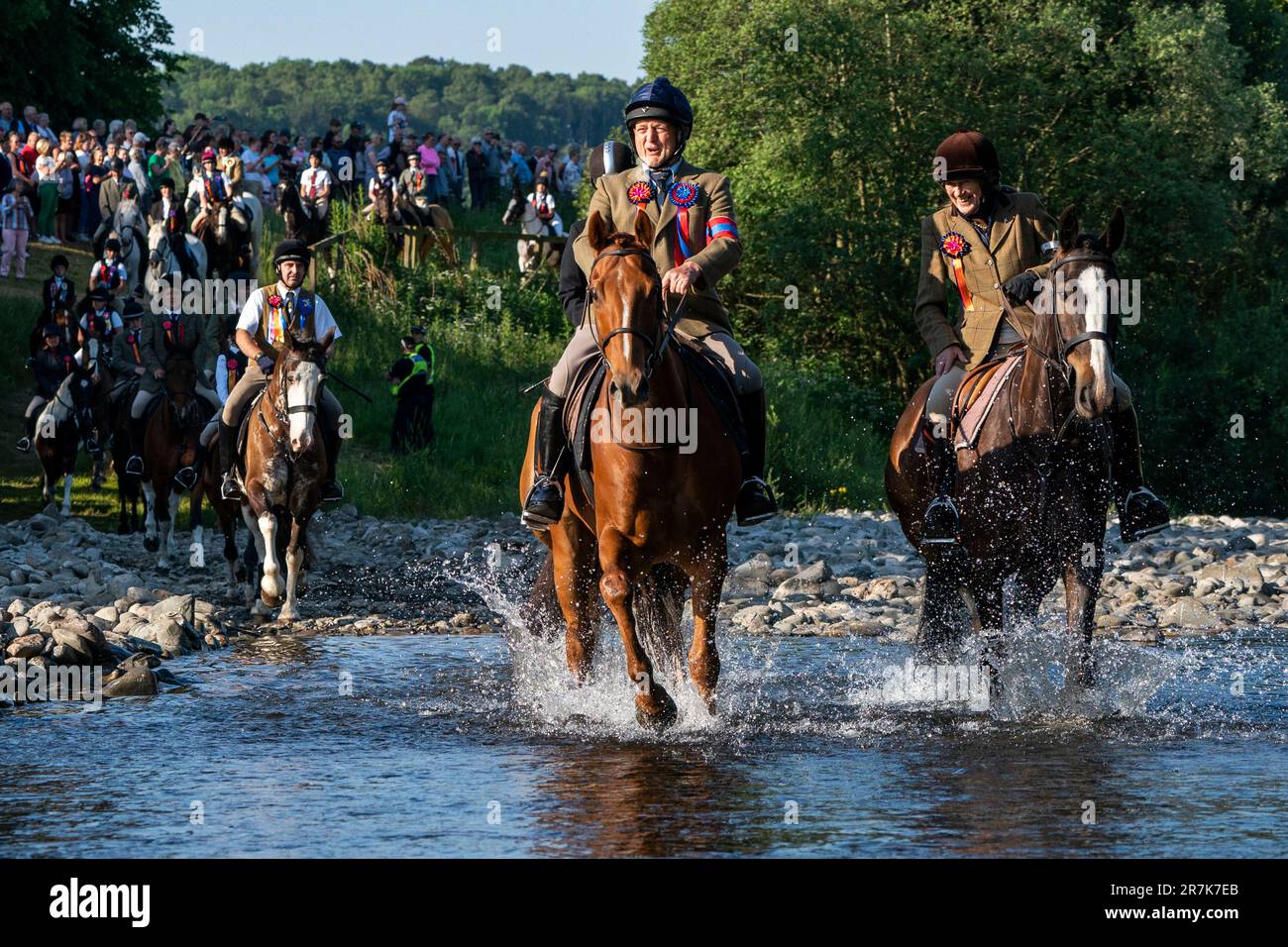 Riders ford the River Ettrick during the Selkirk Common Riding, a ...