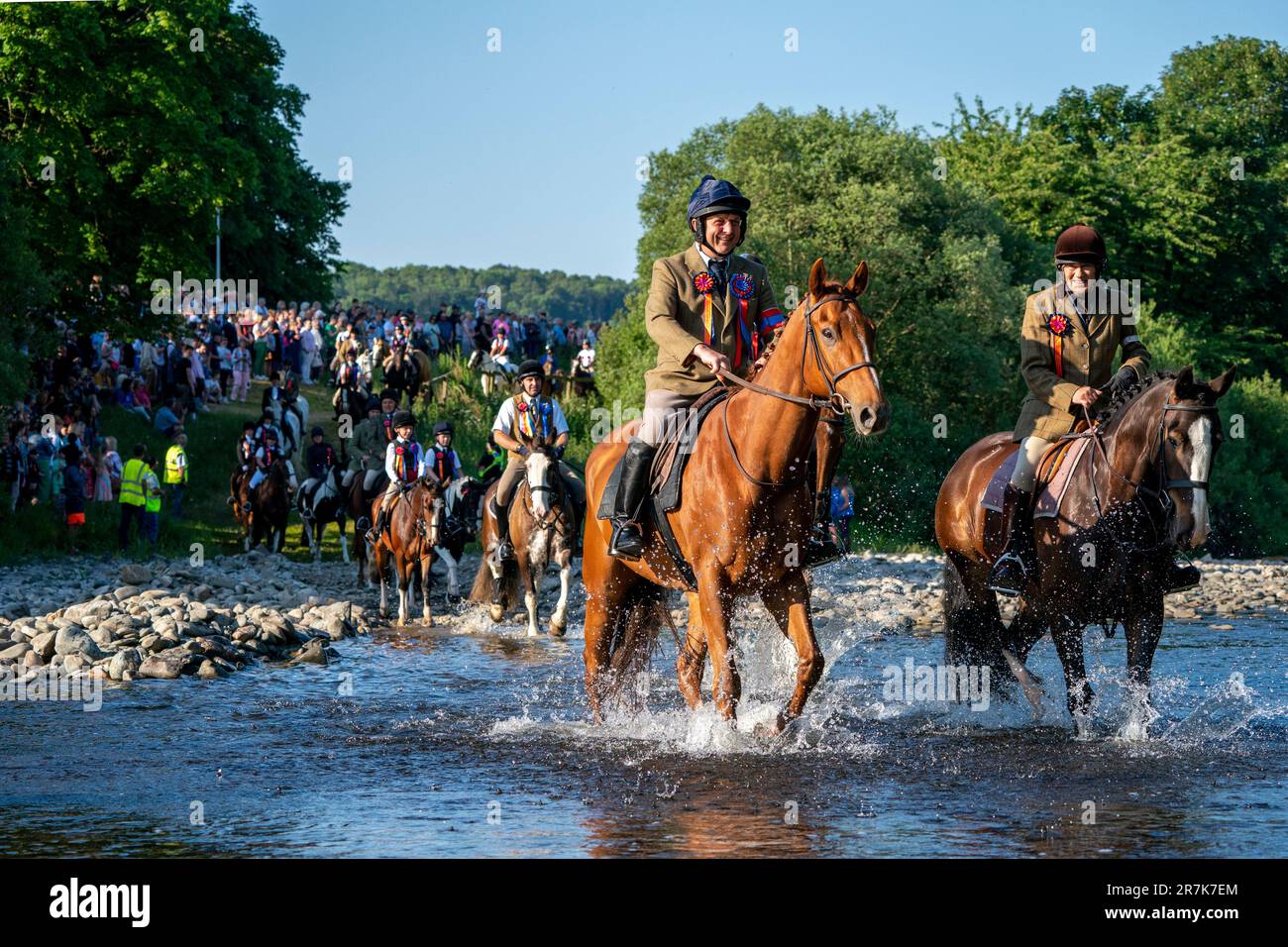 Riders ford the River Ettrick during the Selkirk Common Riding, a ...