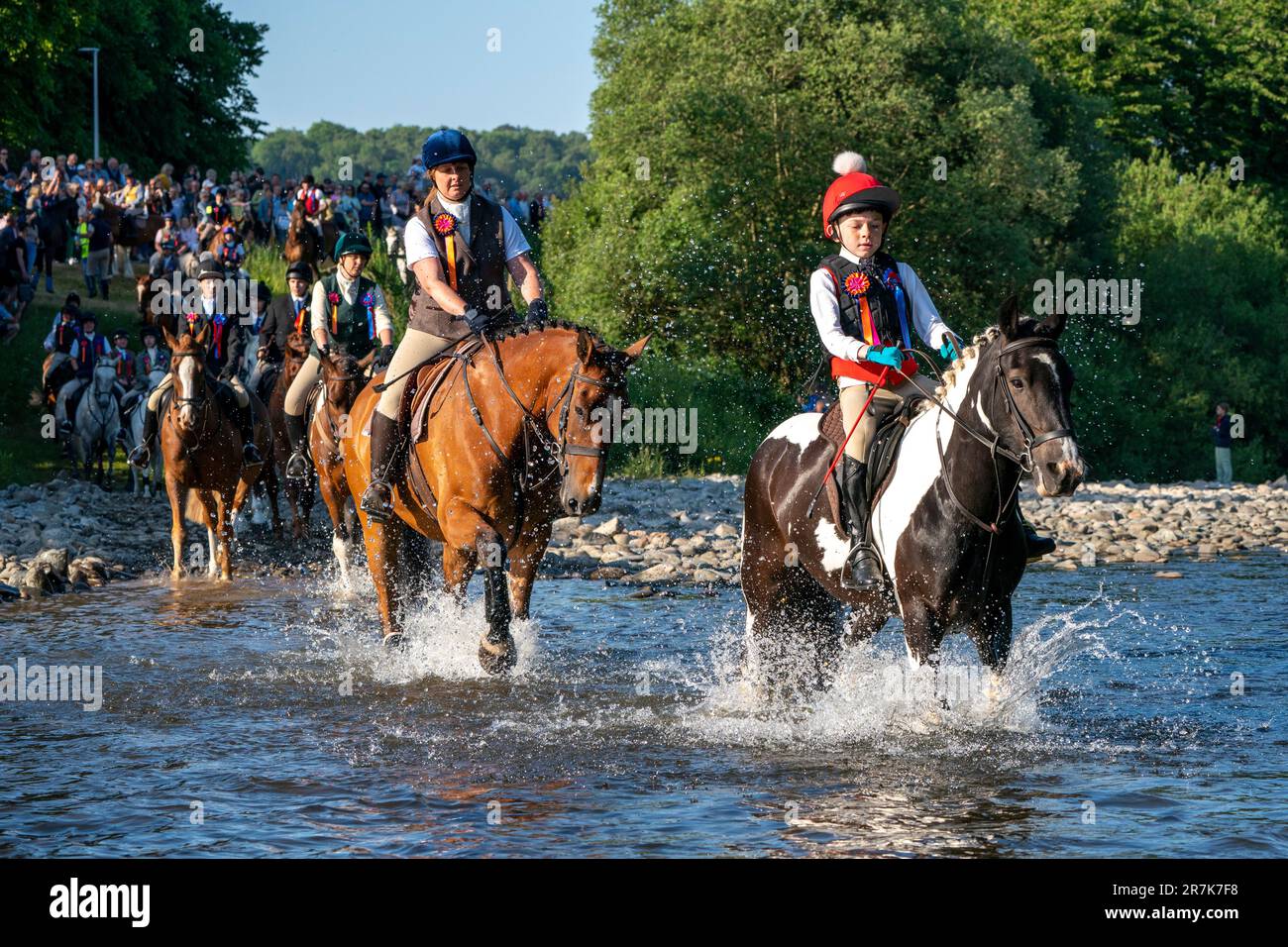 Riders ford the River Ettrick during the Selkirk Common Riding, a ...
