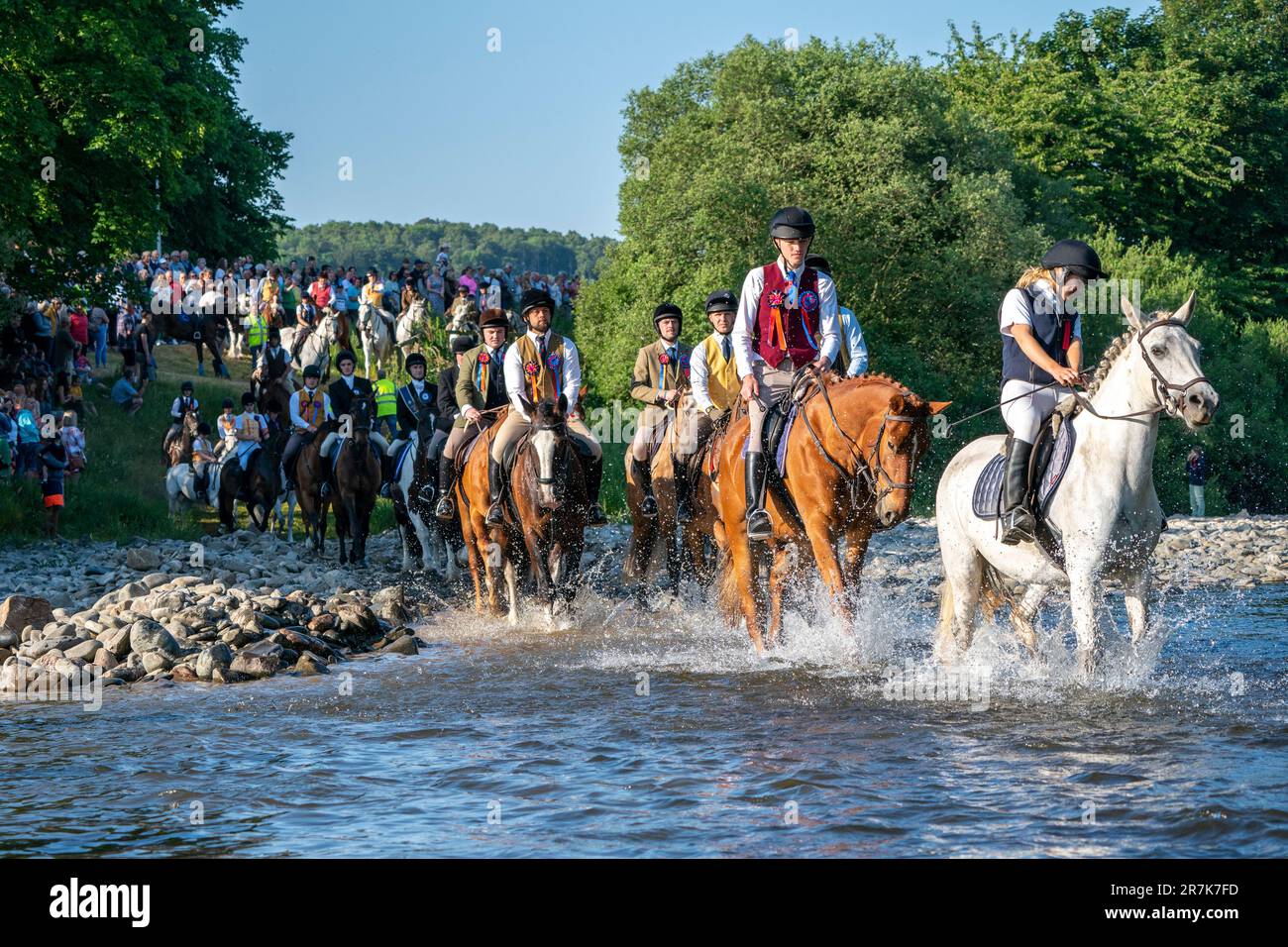 Riders ford the River Ettrick during the Selkirk Common Riding, a ...