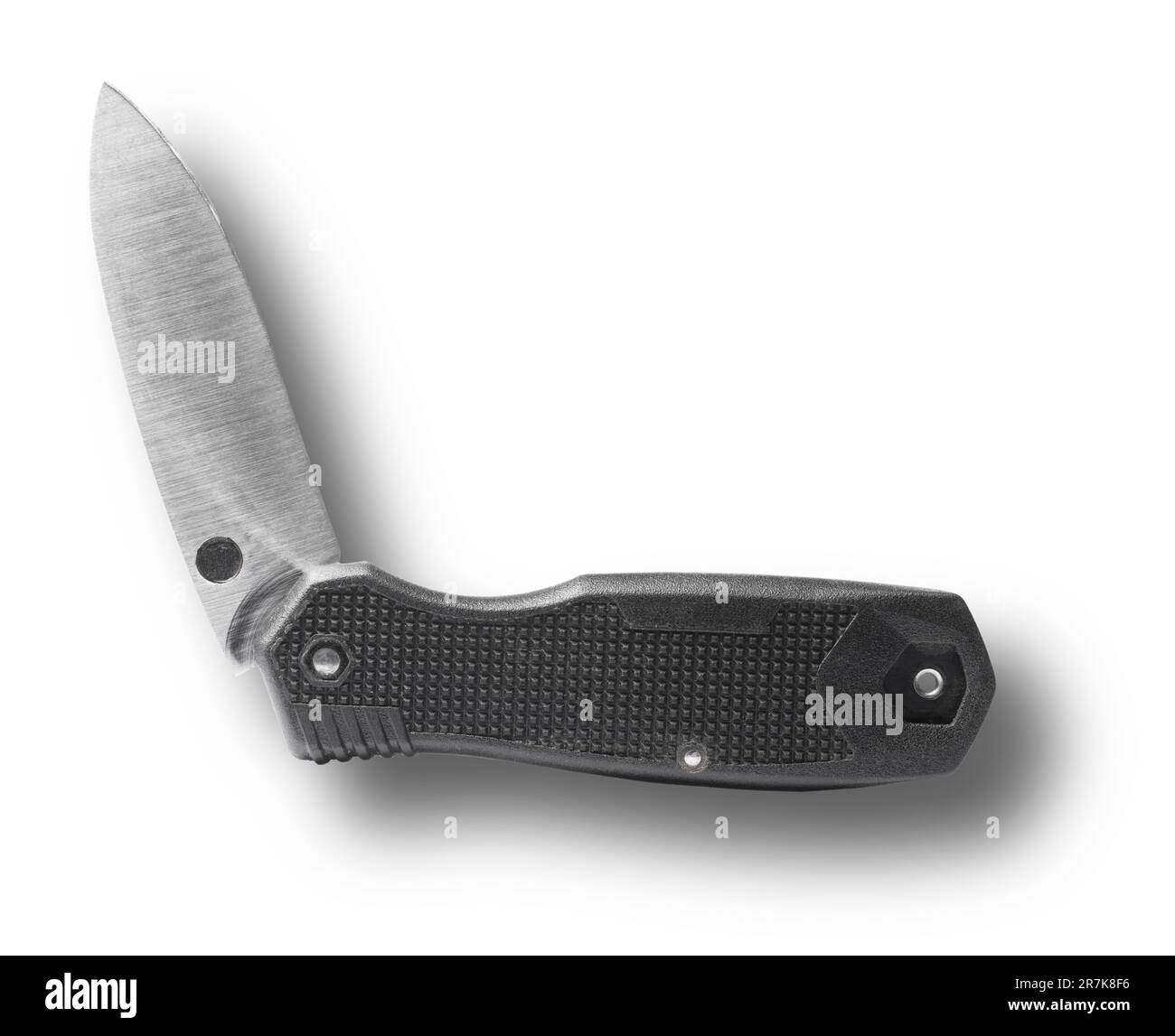 Shadow below a Black folding knife that is designed for everyday carry ...