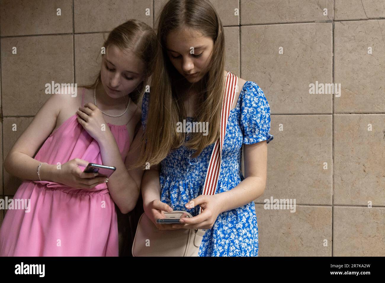 Kyiv, Ukraine. 16th June, 2023. Two girls take cover in the Kyiv metro ...