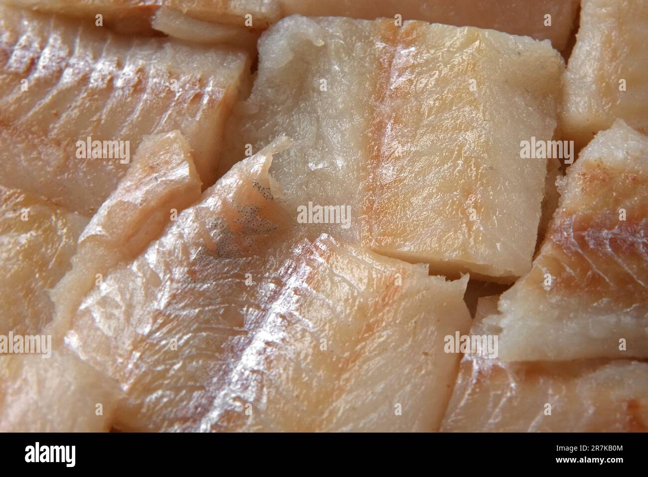 Raw fish fillet is spinning. Top view. Slices of fresh whitefish. Full ...