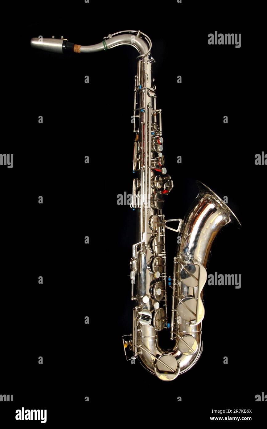 old saxophone isolated on the black background Stock Photo - Alamy