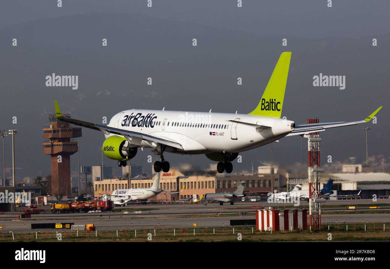 Plane Airbaltic airline lands on the runway in an aeroport El Prat city ...