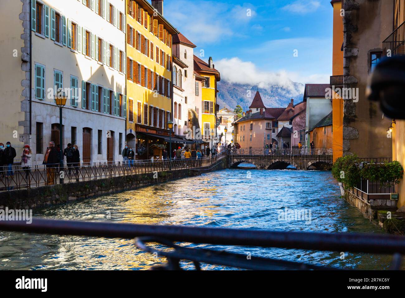 French town of Annecy with pastel houses along Thiou river on winter ...