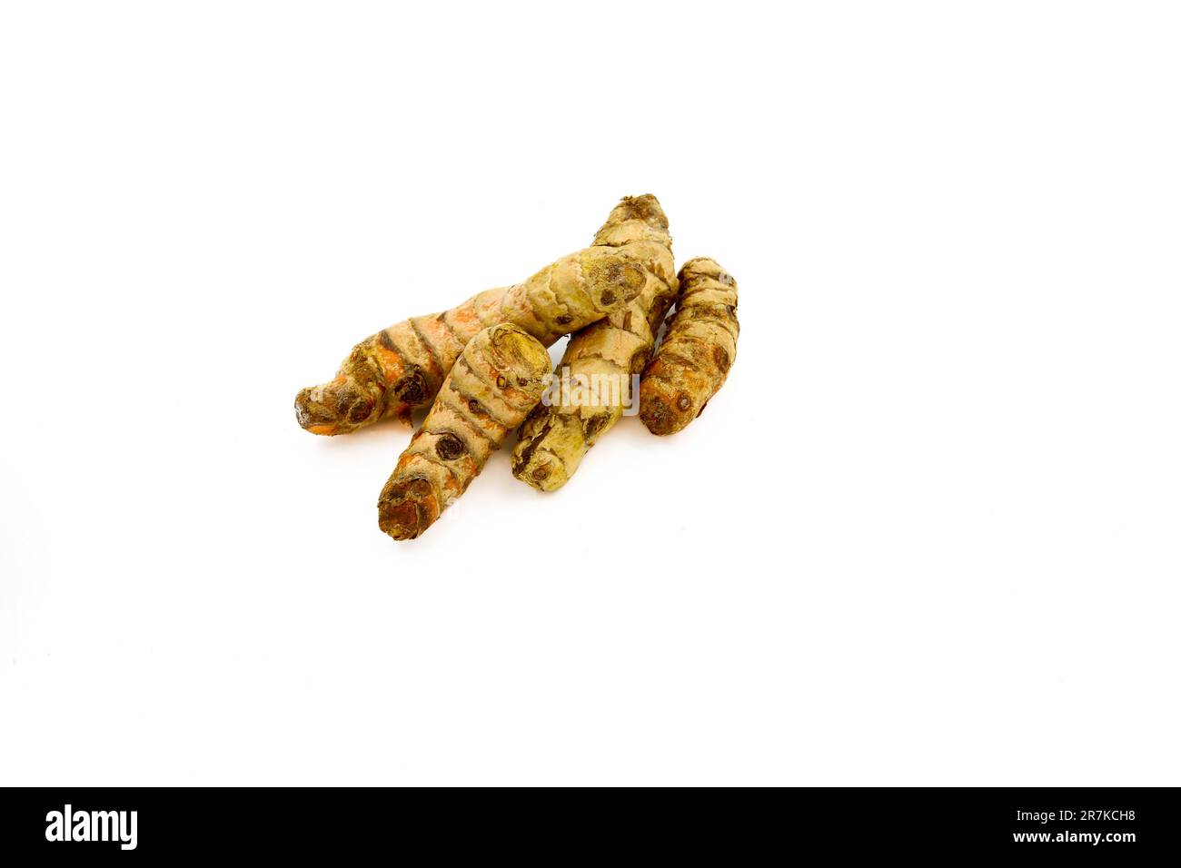 Turmeric root on white background Stock Photo - Alamy