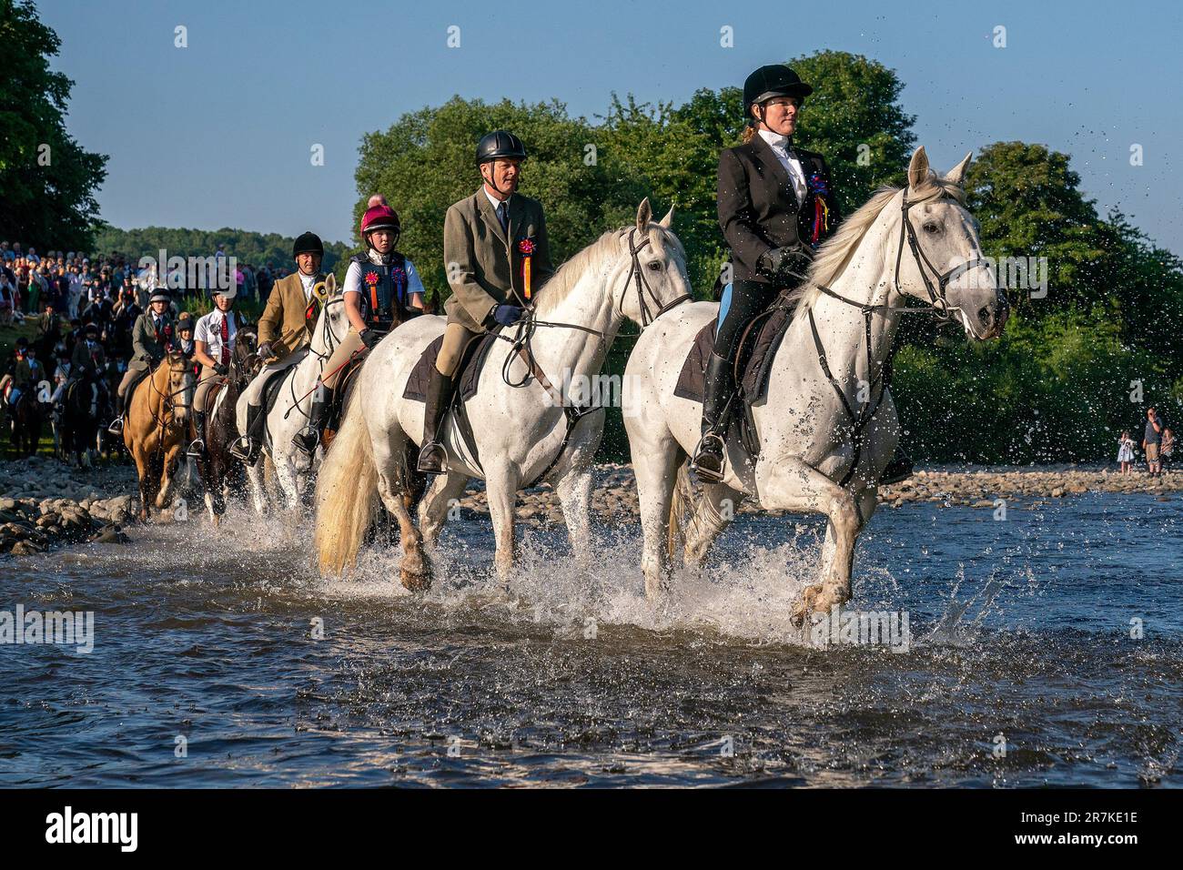 Riders ford the River Ettrick during the Selkirk Common Riding, a ...