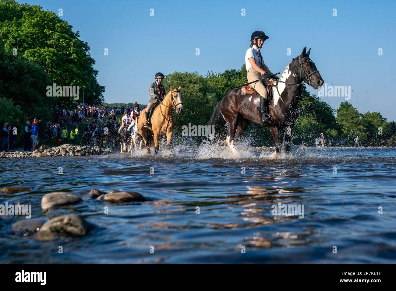 Riders ford the River Ettrick during the Selkirk Common Riding, a ...