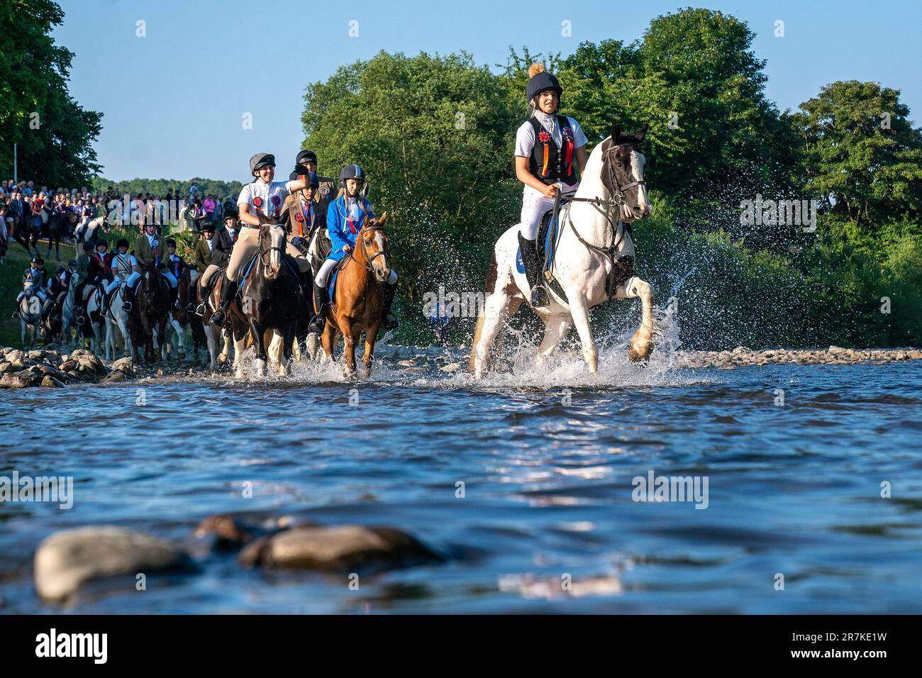 Riders ford the River Ettrick during the Selkirk Common Riding, a ...