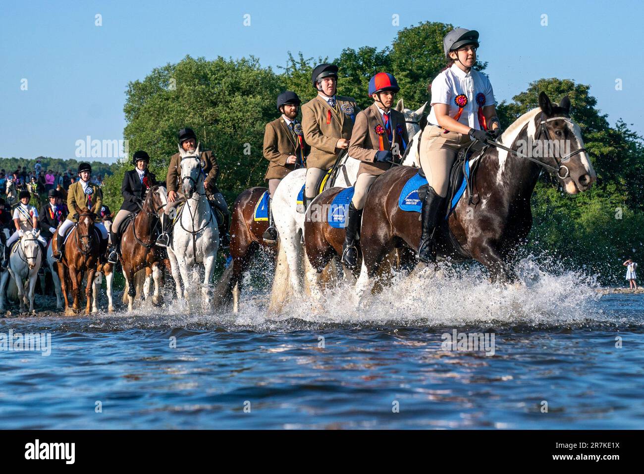 Riders ford the River Ettrick during the Selkirk Common Riding, a ...