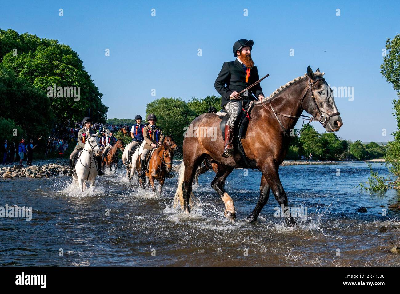 Riders ford the River Ettrick during the Selkirk Common Riding, a ...