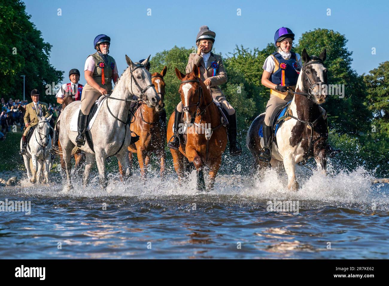 Riders ford the River Ettrick during the Selkirk Common Riding, a ...